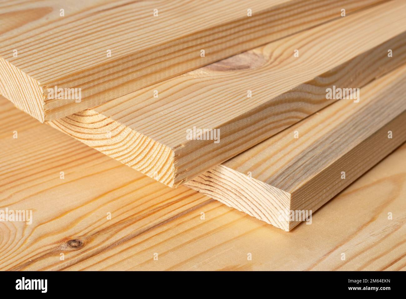 Stacks of pine wood planks. Natural rough wooden boards boards, lumber ...