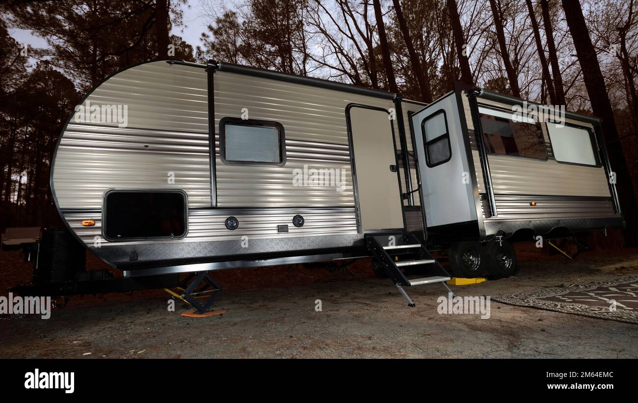 Camper trailer in a dark forest near Jordan Lake in North Carolina ...