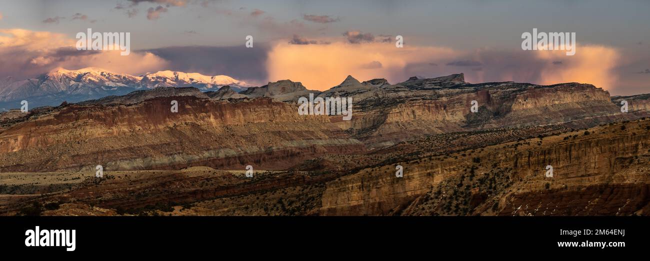 Cloudy Mountains Behind Ridge of Capitol Reef covered in snow Stock ...