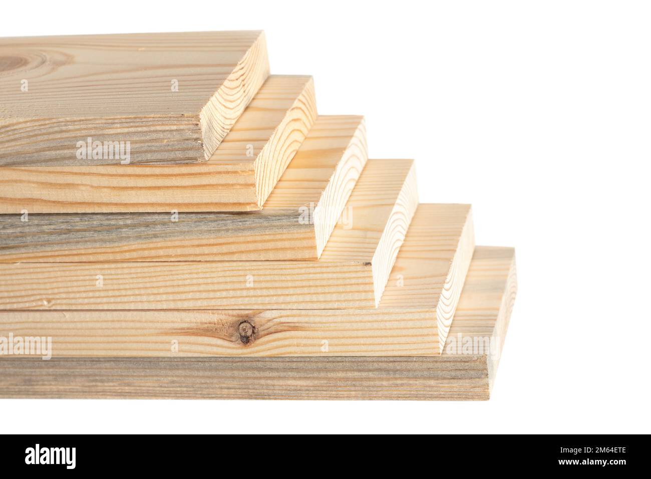 Wooden boards on white in a woodworking industry. stacks with pine ...