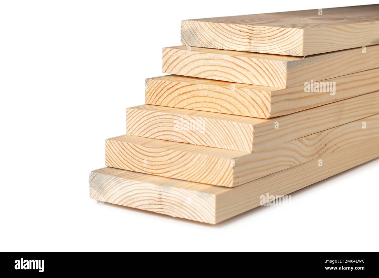 Wooden boards on white in a woodworking industry. stacks with pine ...