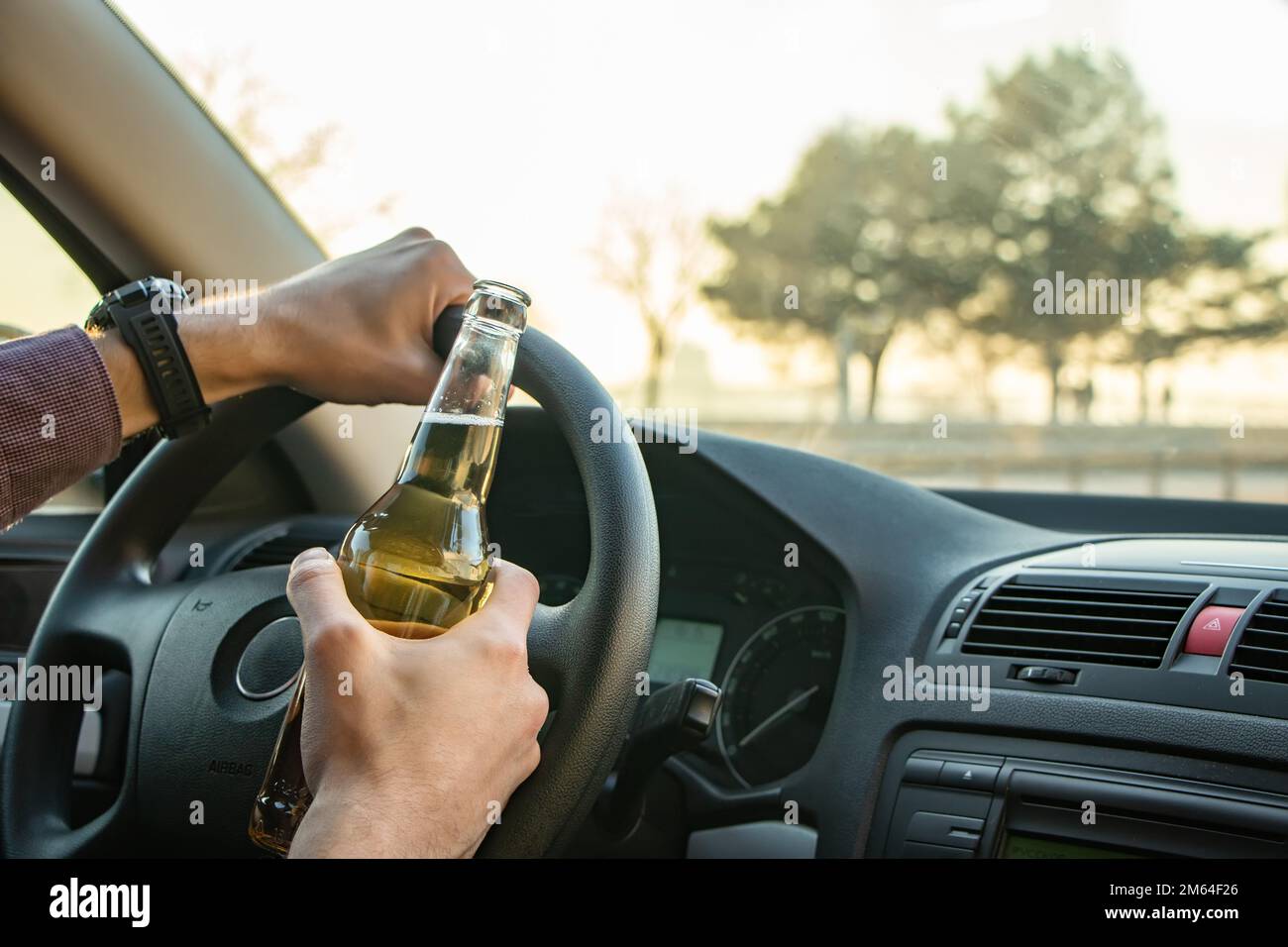 Hand holding beer bottle driving hi-res stock photography and images ...