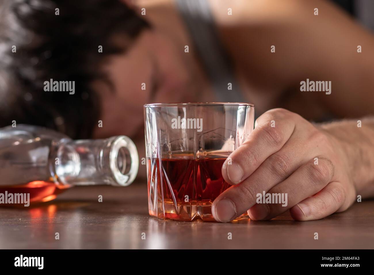 Alcoholism, alcohol addiction and people concept - male alcoholic with ...