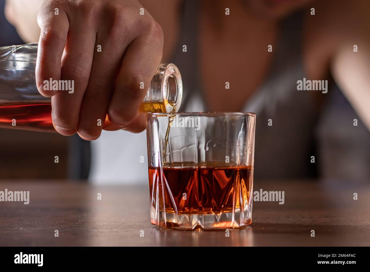 Alcoholism concept. Young man drinking alcohol too much. Alcoholic in a ...