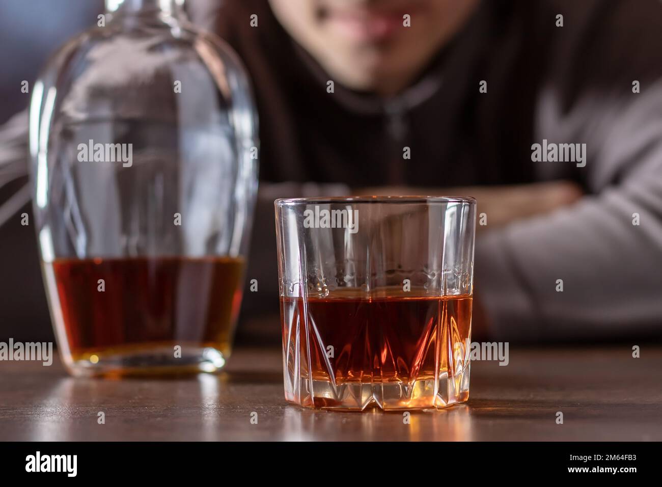 Alcoholism concept. Young man drinking alcohol too much Stock Photo - Alamy