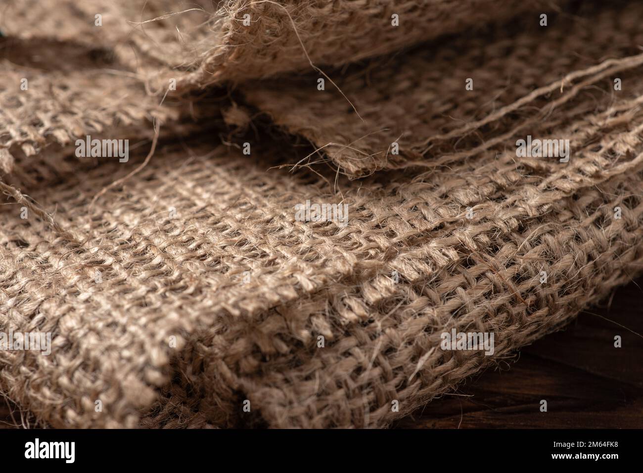 Rural texture of sackcloth. Background of very coarse, rough fabric woven made of flax, jute or ...