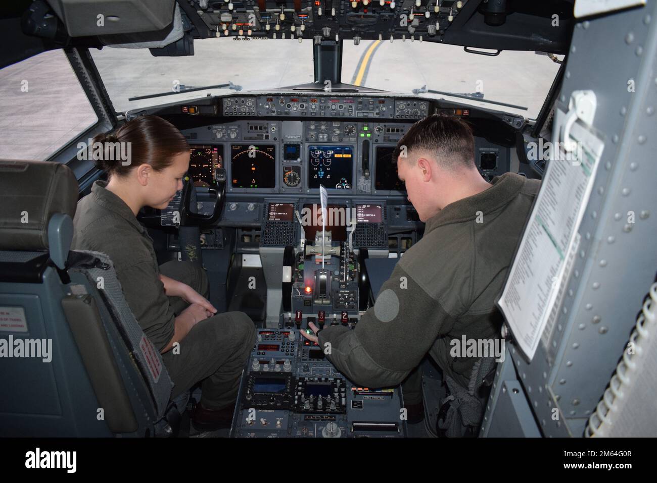 U.S. Marine Corps Staff Sgt. Song, left, a C-40A Clipper crew chief ...