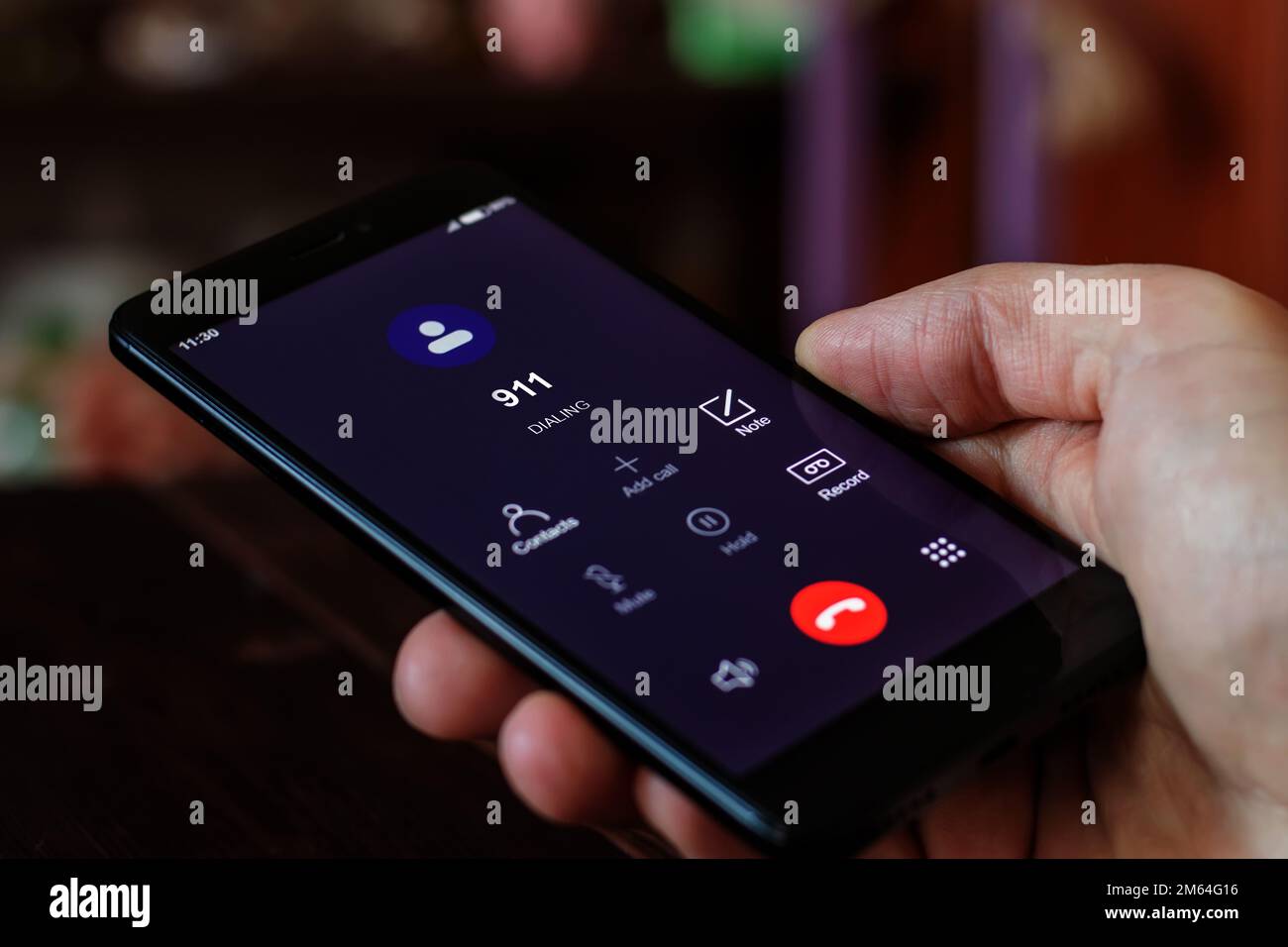 Dialing 911, call 911. Emergency concept: man using a digital phone ...
