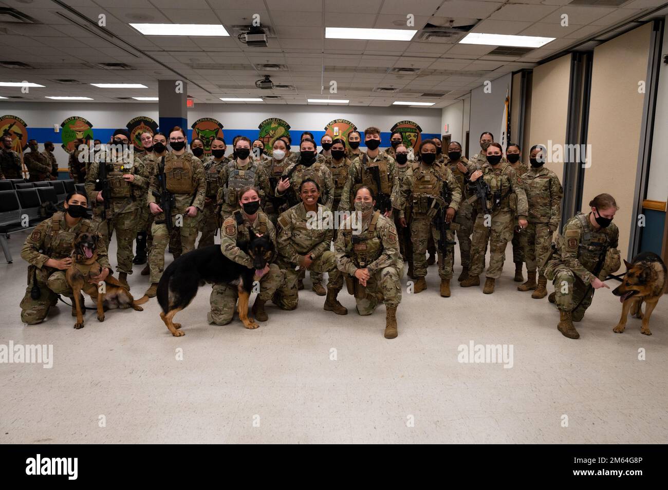 Airmen assigned to the 51st Security Forces Squadron, gather for a ...