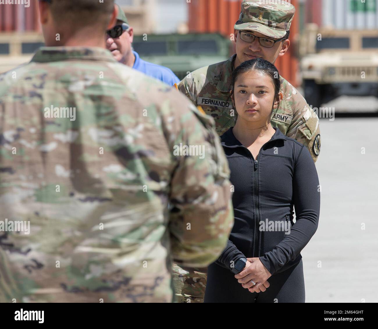 Christine Fernando and her husband, 2nd Lt. Brandon Fernando, listen to ...