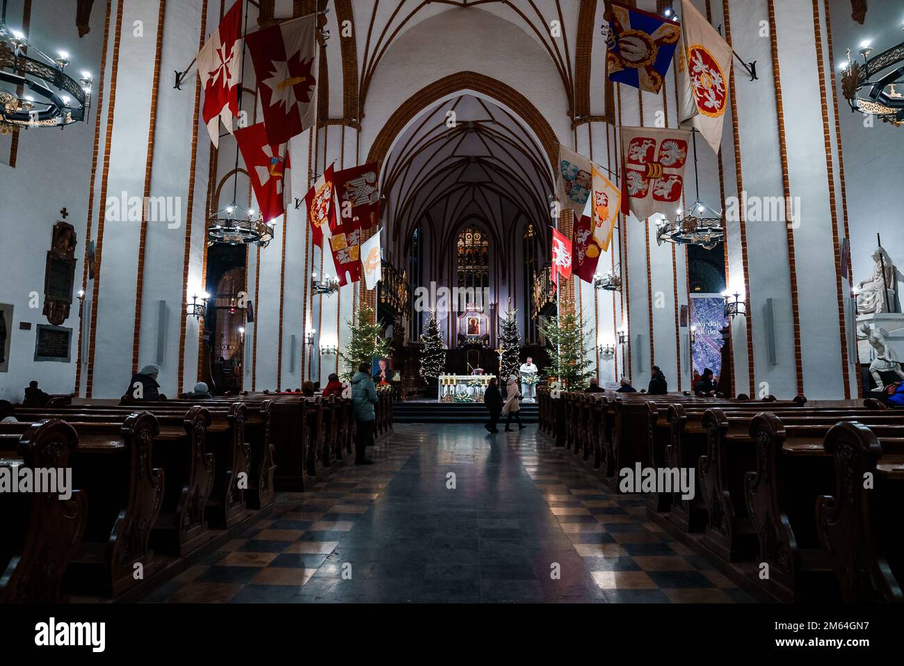 Priest holding church service in front of crowd in the Catholic church ...
