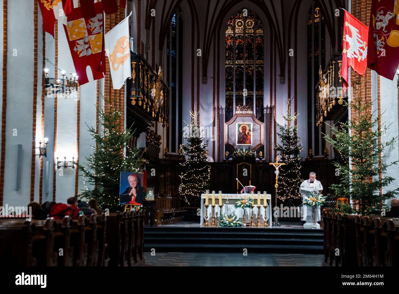 Priest holding church service in front of crowd in the Catholic church ...
