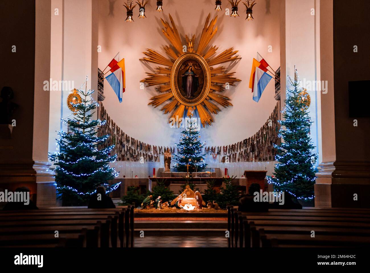 Priest holding church service in front of crowd in the Catholic church ...