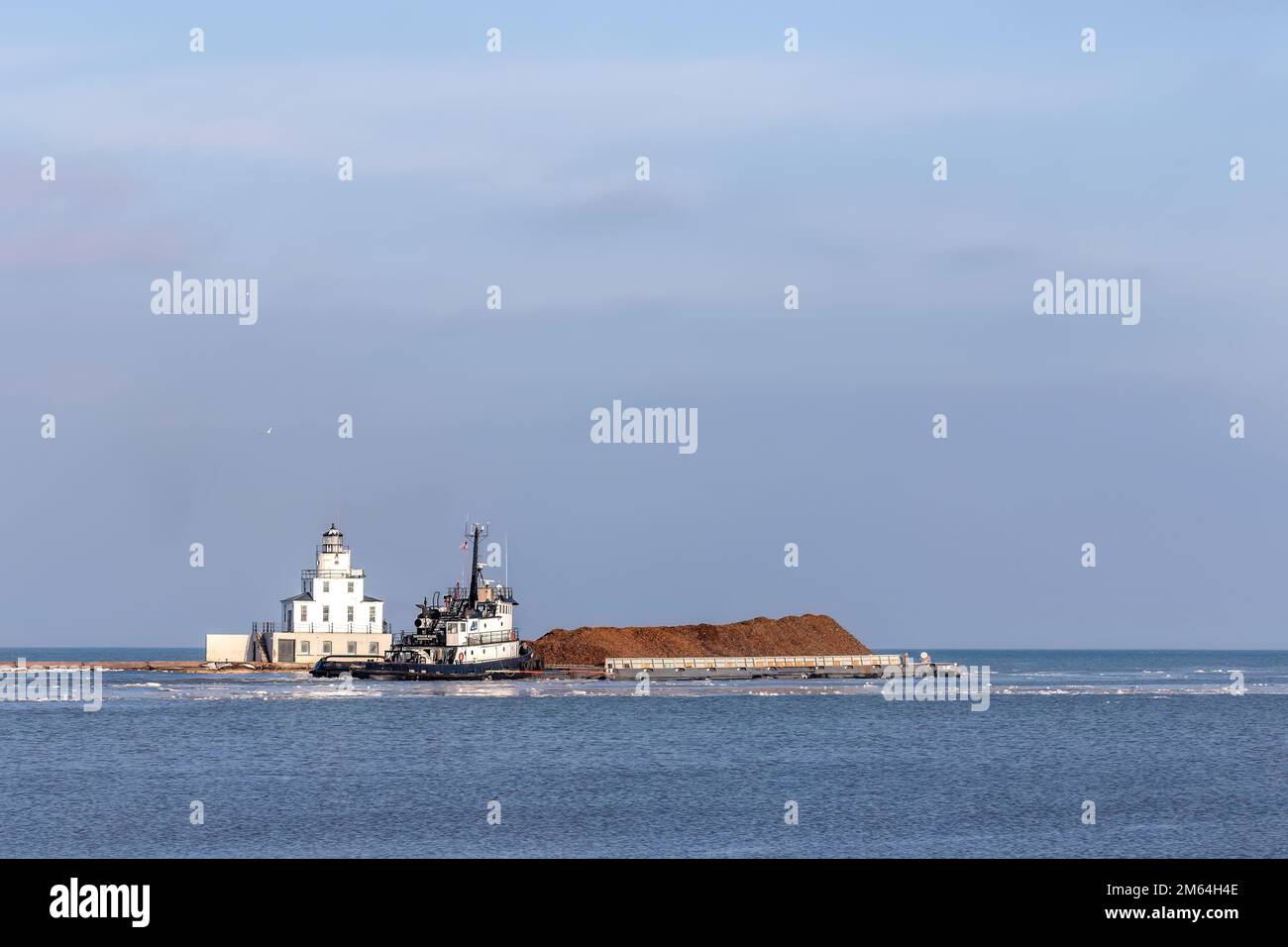 Manitowoc, WI USA January 2 2023: tugboat carrying cargo across Lake ...