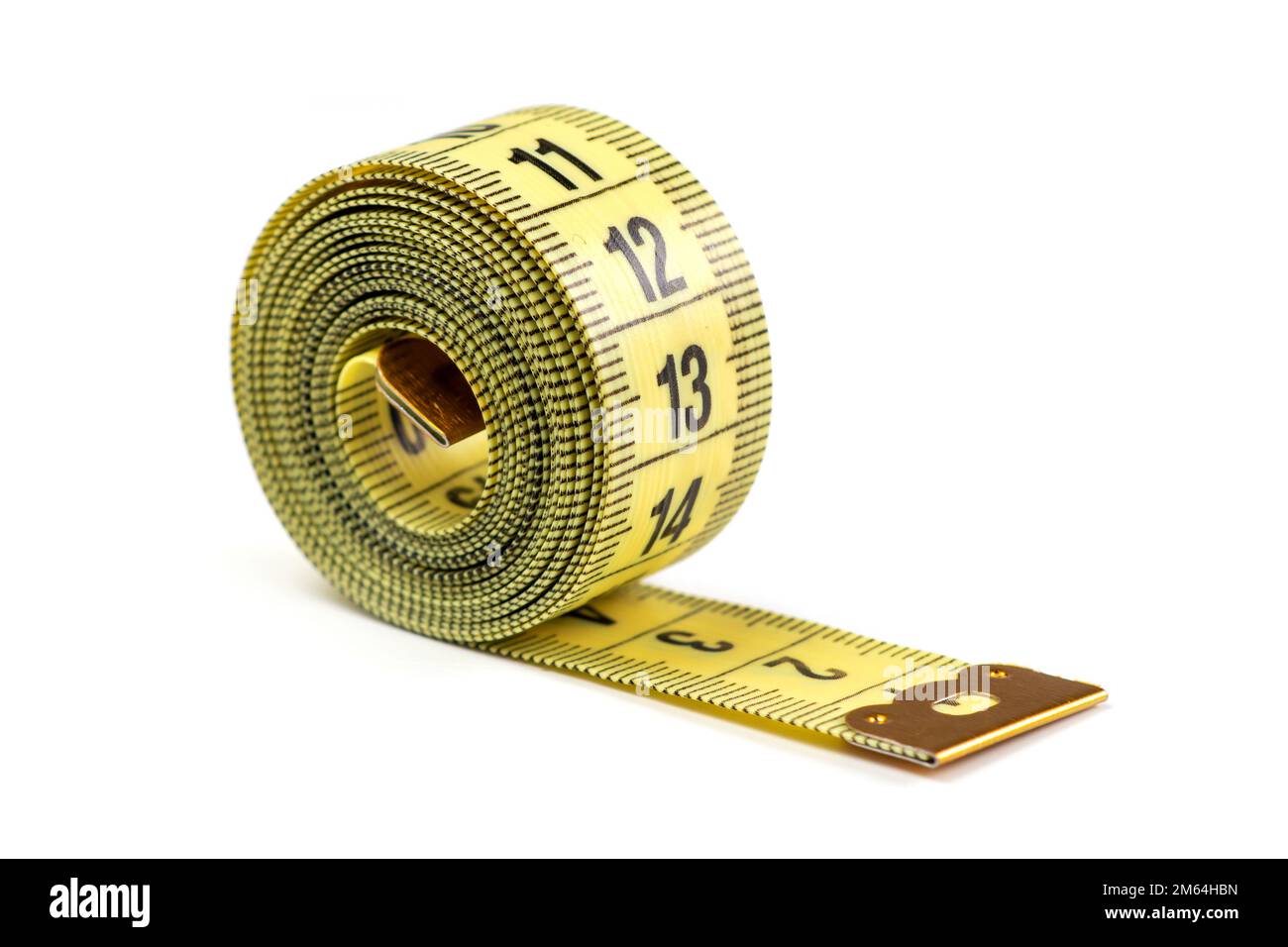 Yellow measuring tape isolated on white background Stock Photo - Alamy