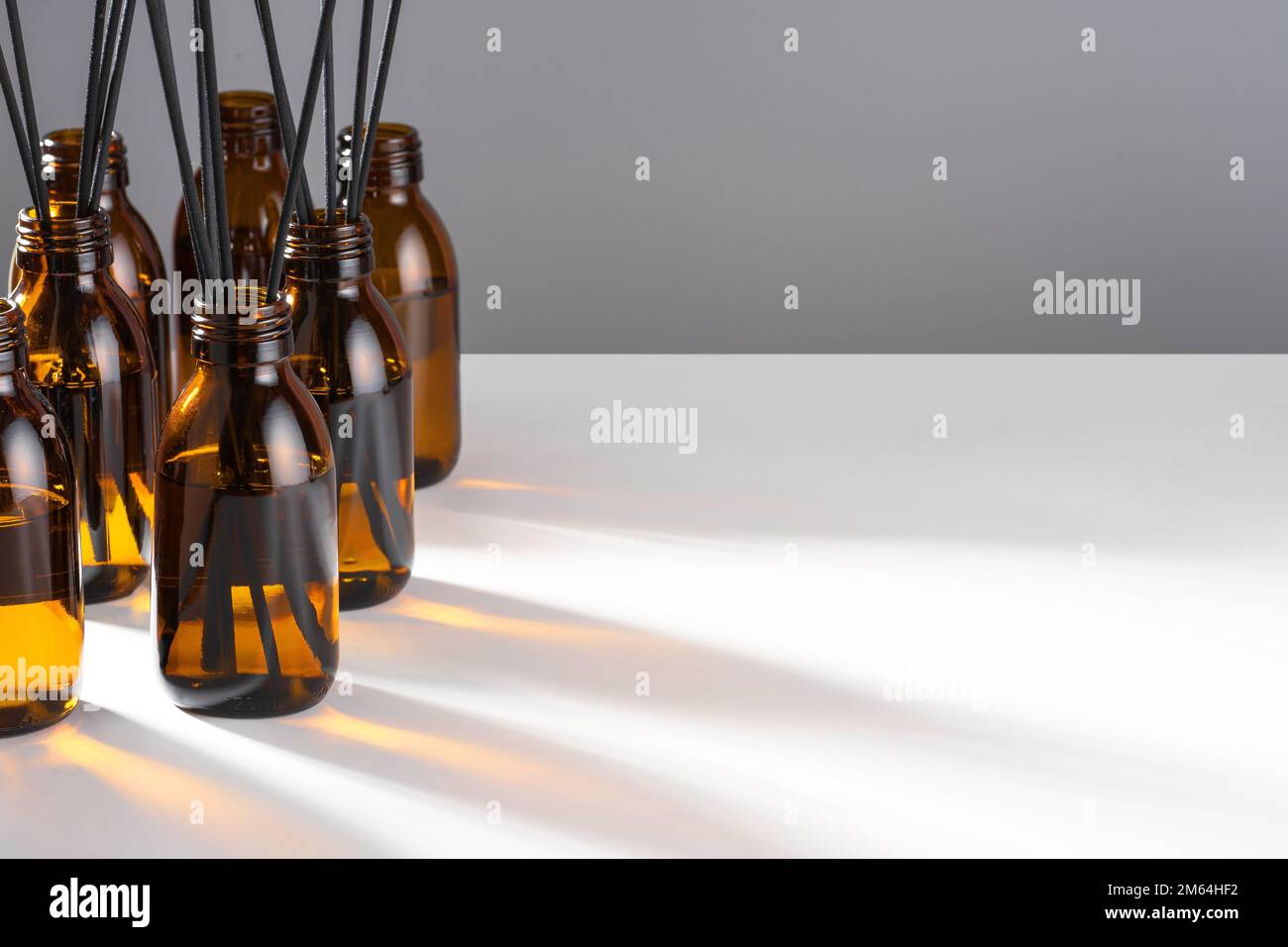 Group of Aroma diffuser with essential oil in a Amber, brown glass ...