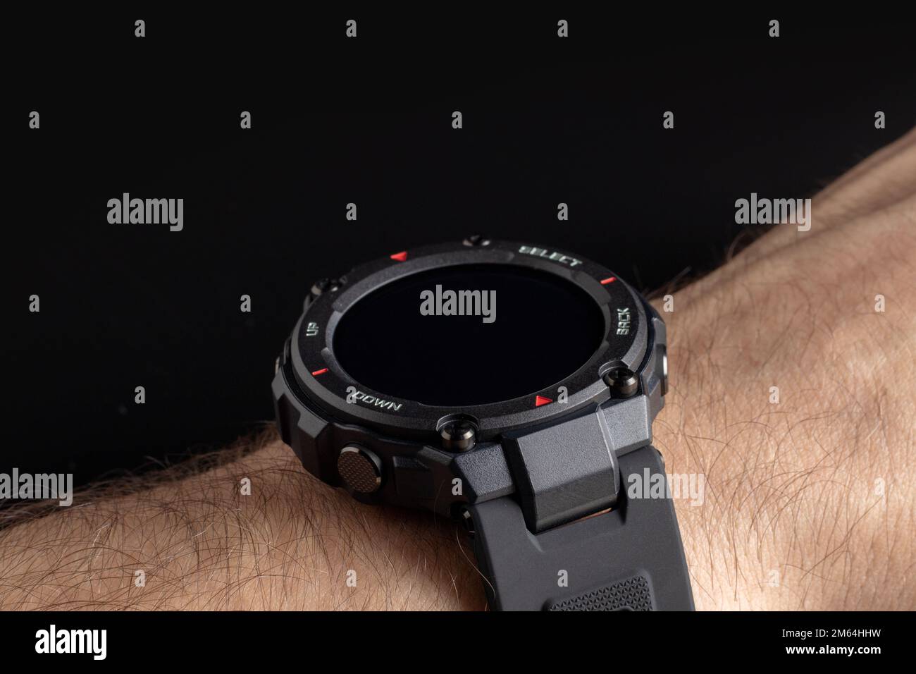 Human hand wearing smart watch on black background. Wearable gadget ...