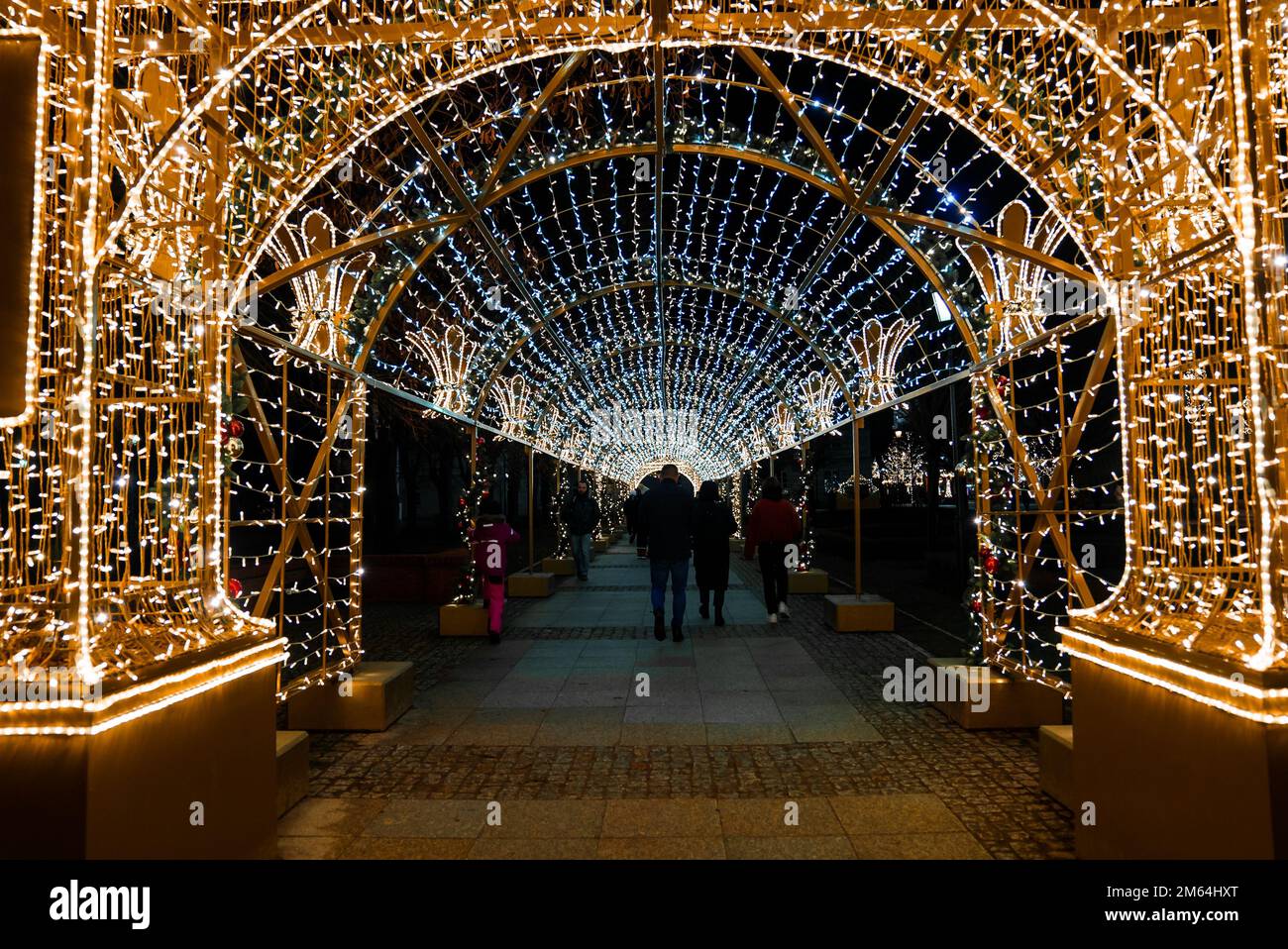 Magical Christmas market in Warsaw with people around buying presents ...