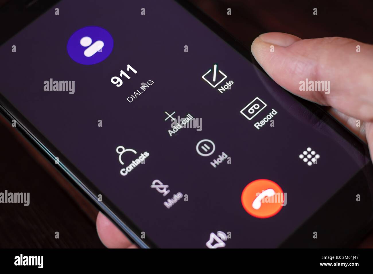 Dialing 911, call 911. Emergency concept: man using a digital phone with emergency call on the ...