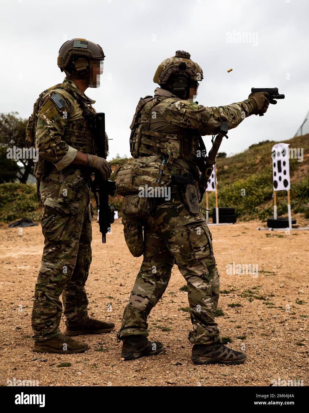 In preparation for Exercise Orion, a Greek Special Operations Forces (SOF) member fires an M9 ...
