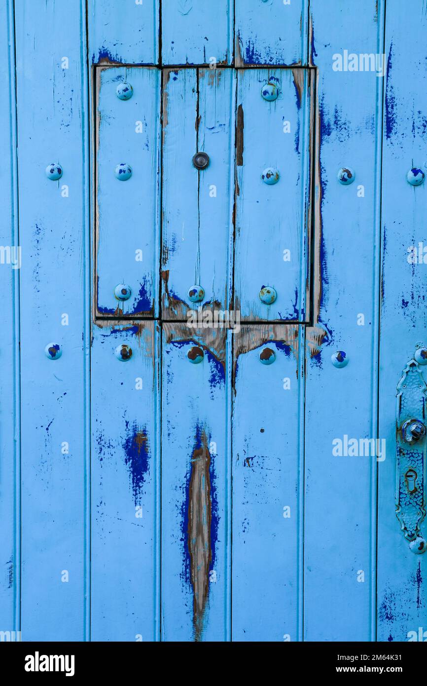 Texture of old blue wooden door in Spain Stock Photo - Alamy