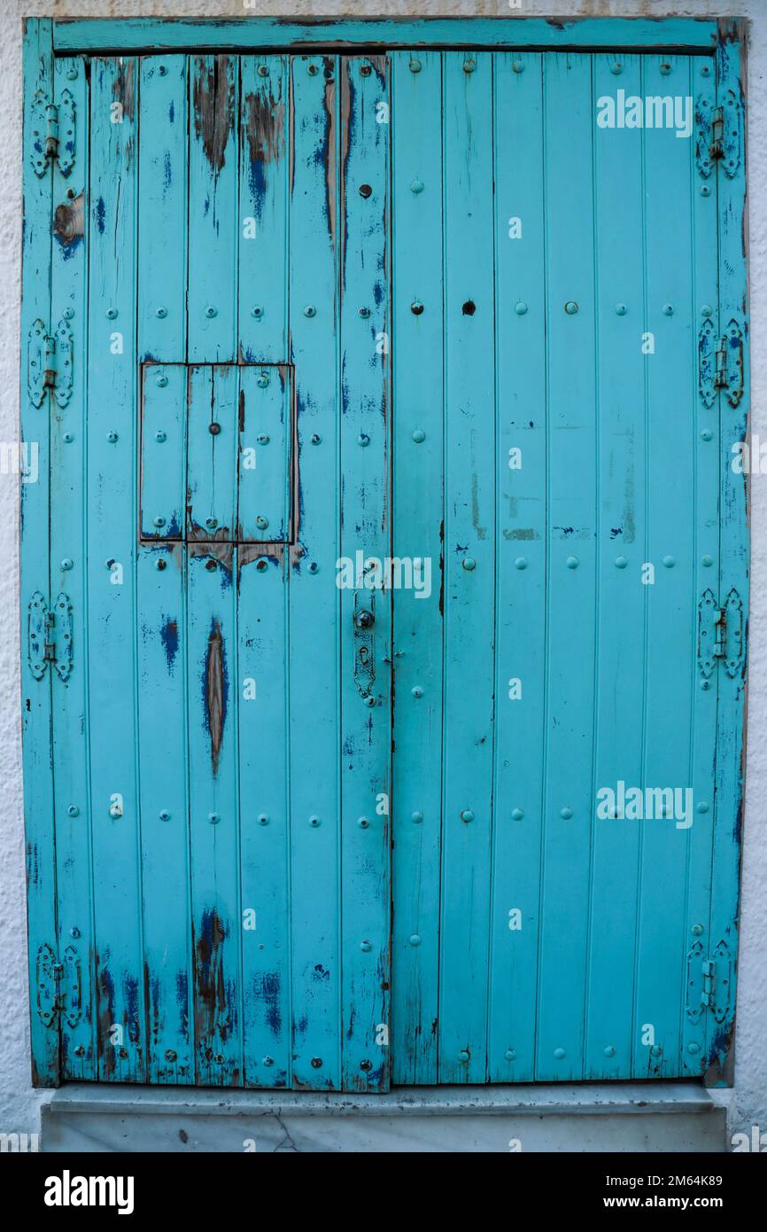Texture of old blue wooden door in Spain Stock Photo - Alamy