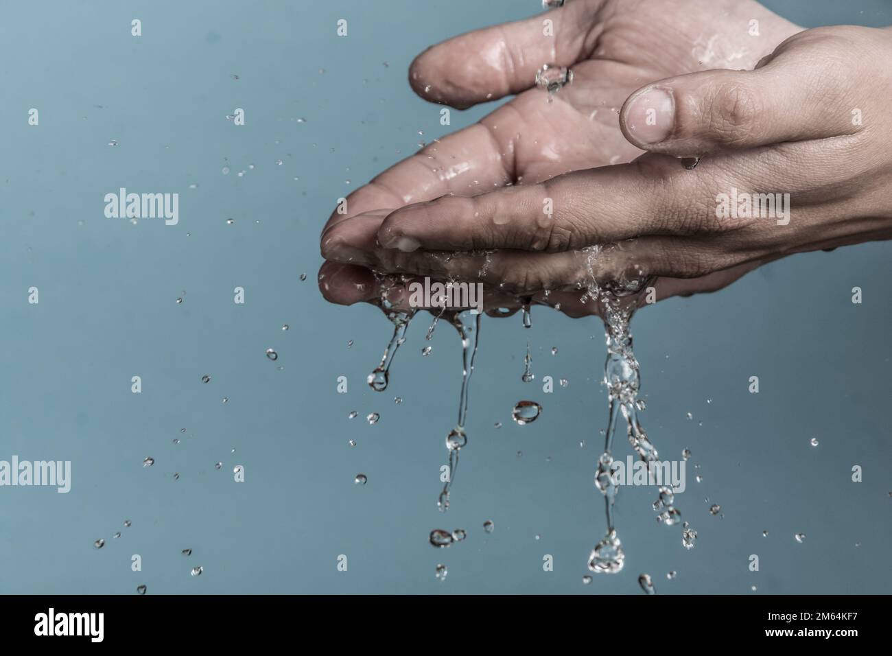 water flows on the hand Stock Photo - Alamy