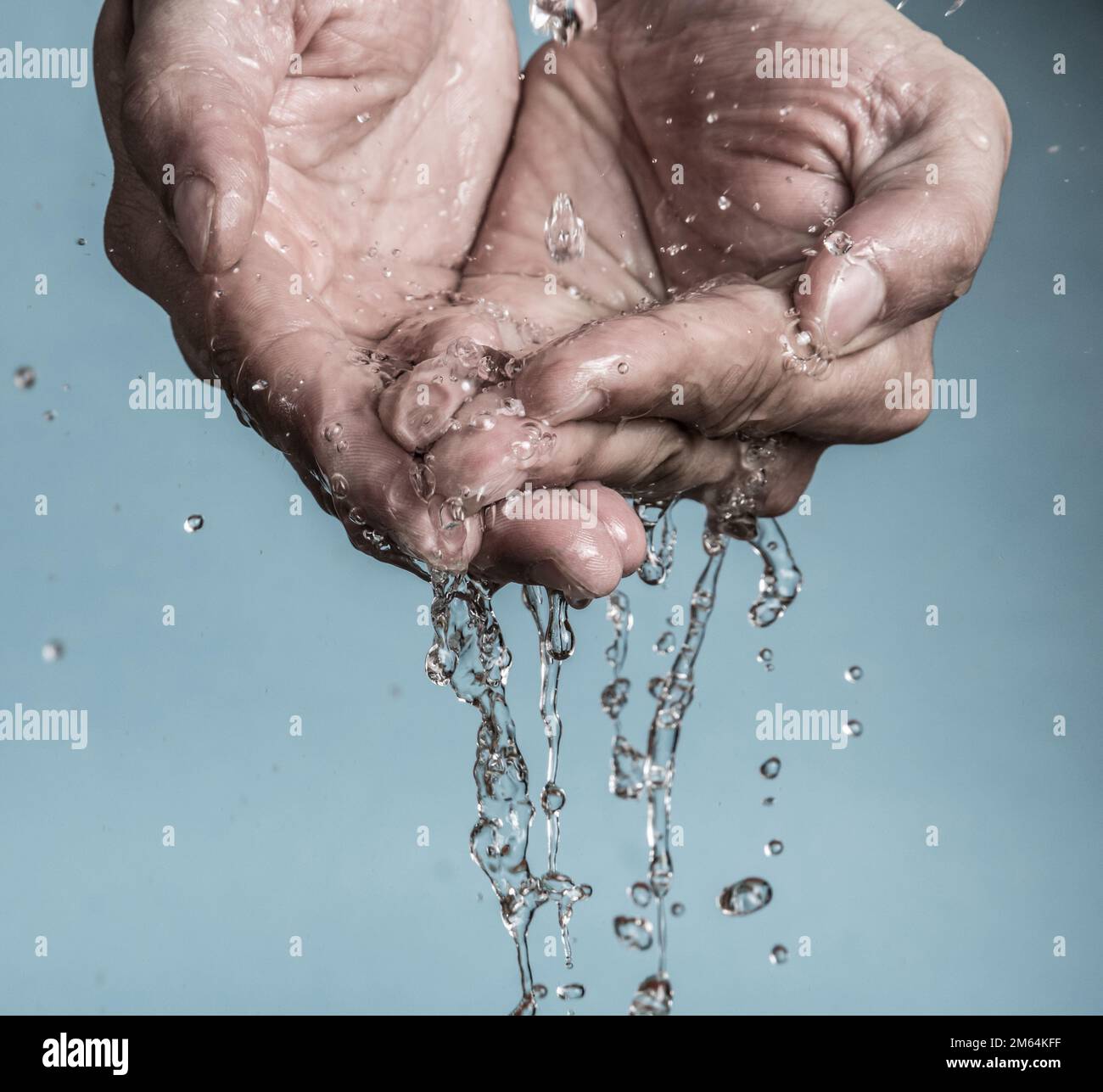 water flows on the hand Stock Photo - Alamy