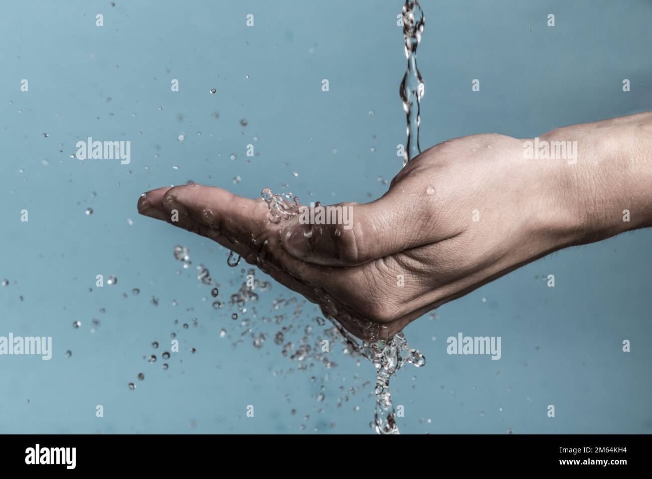 water flows on the hand Stock Photo - Alamy