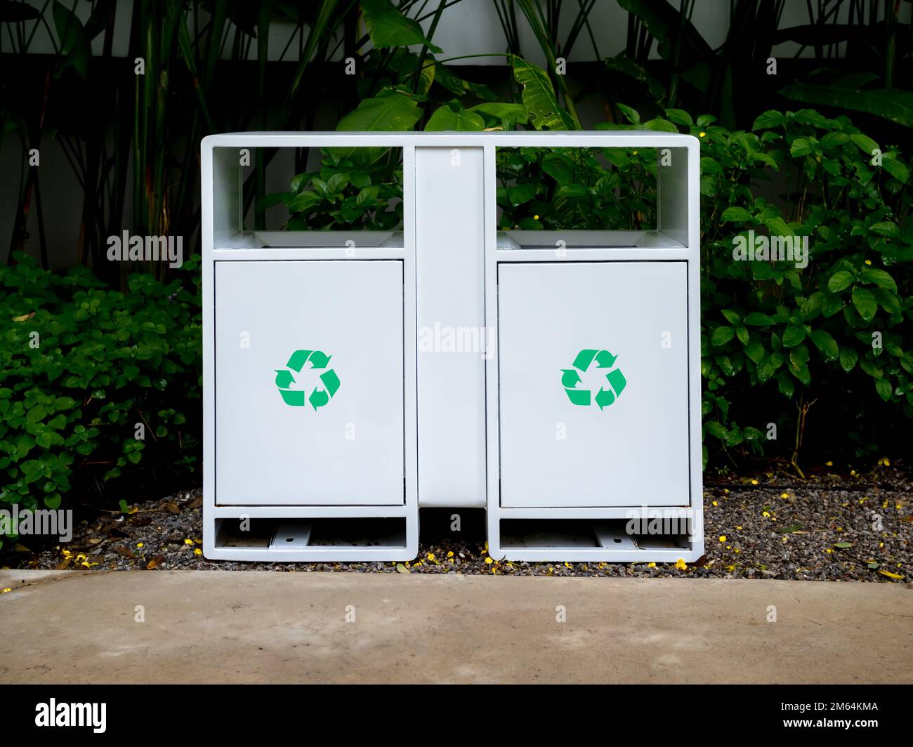 Green recycle icon symbols on modern white twin iron rectangle recycle ...