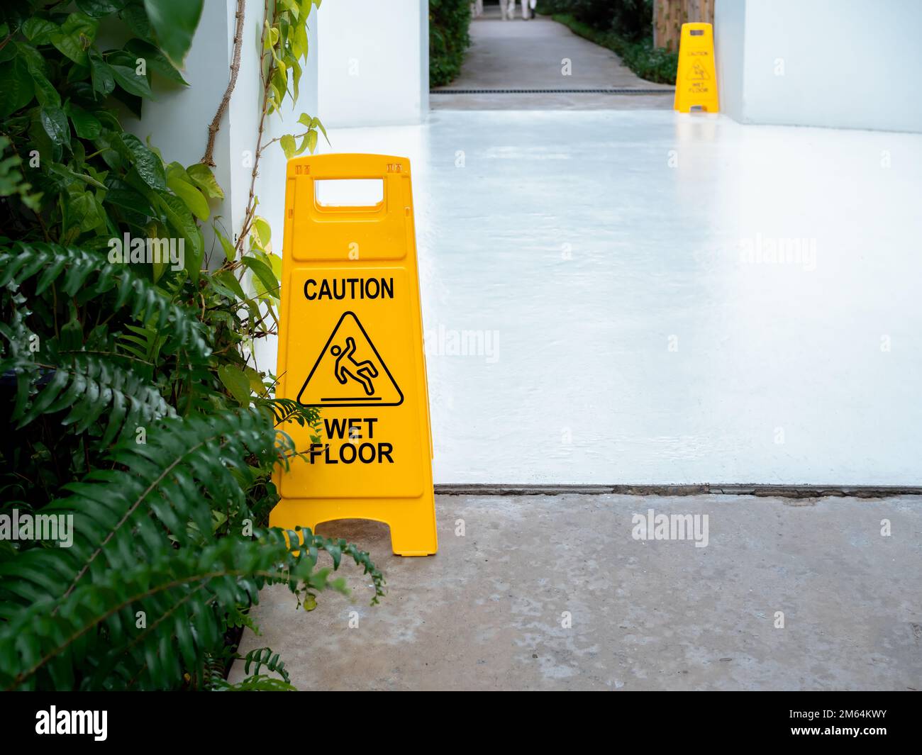 Yellow caution slippery wet floor sign with slippery person warning ... Yellow caution slippery wet floor sign with slippery person warning ...