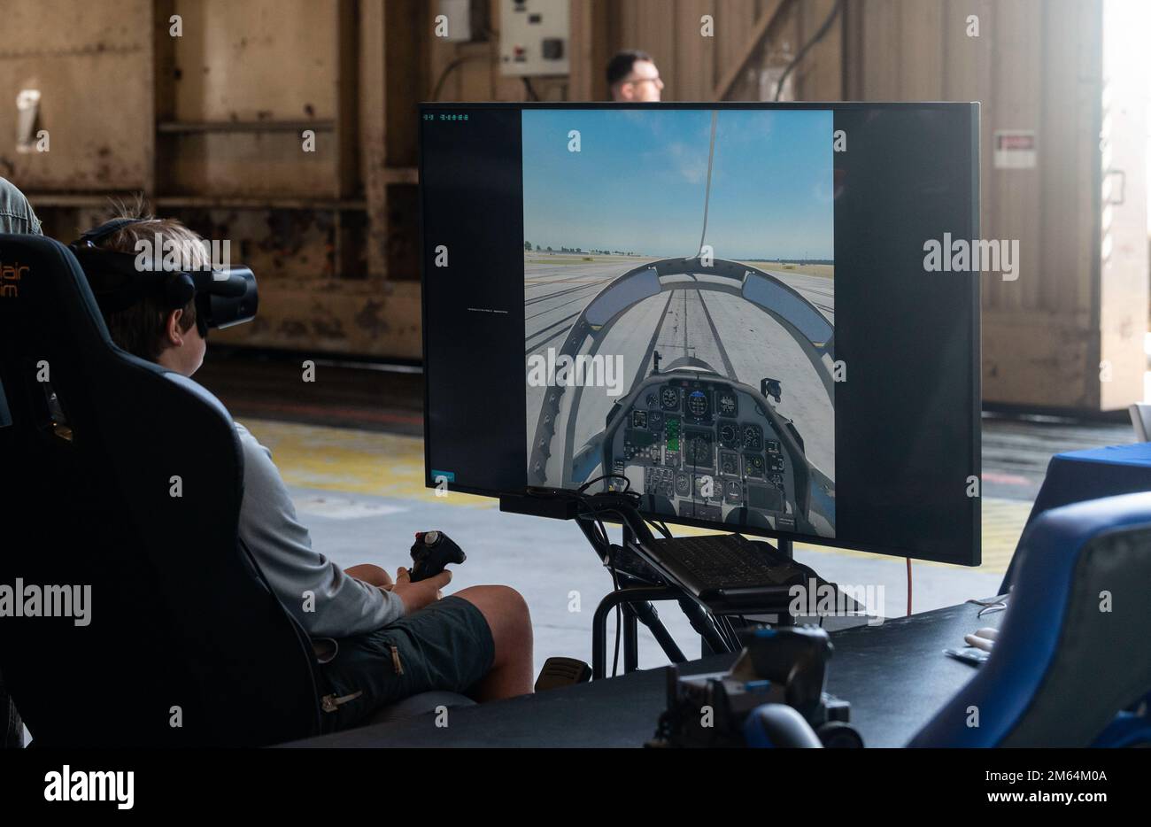 A child interacts with a flight simulator at the Science, Technology ...