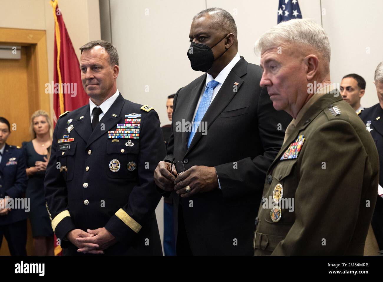 Secretary of Defense Lloyd J. Austin III attends a briefing with, left ...