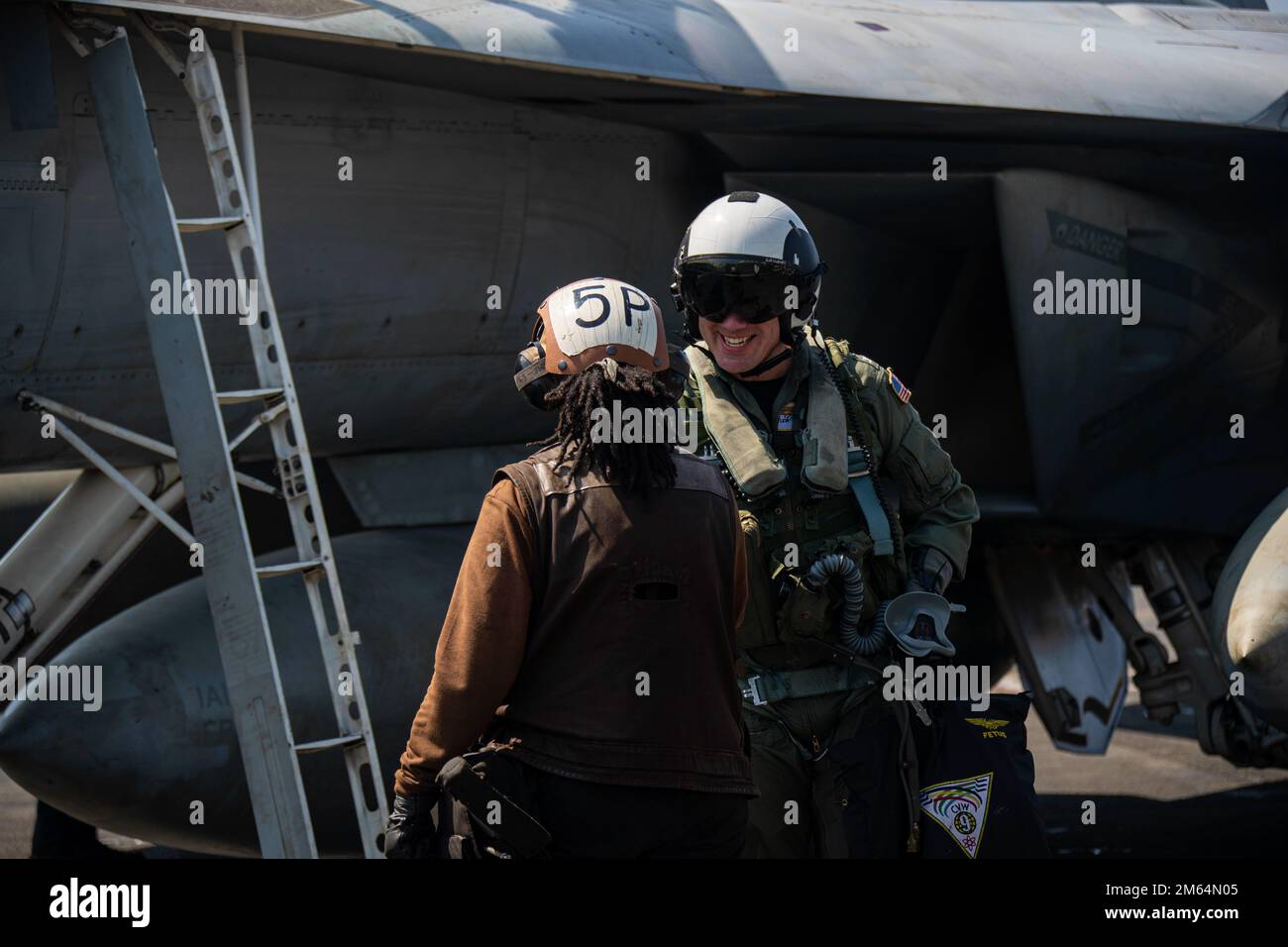 SOUTH CHINA SEA (April 1, 2022) Capt. Lewis Callaway, right, incoming ...