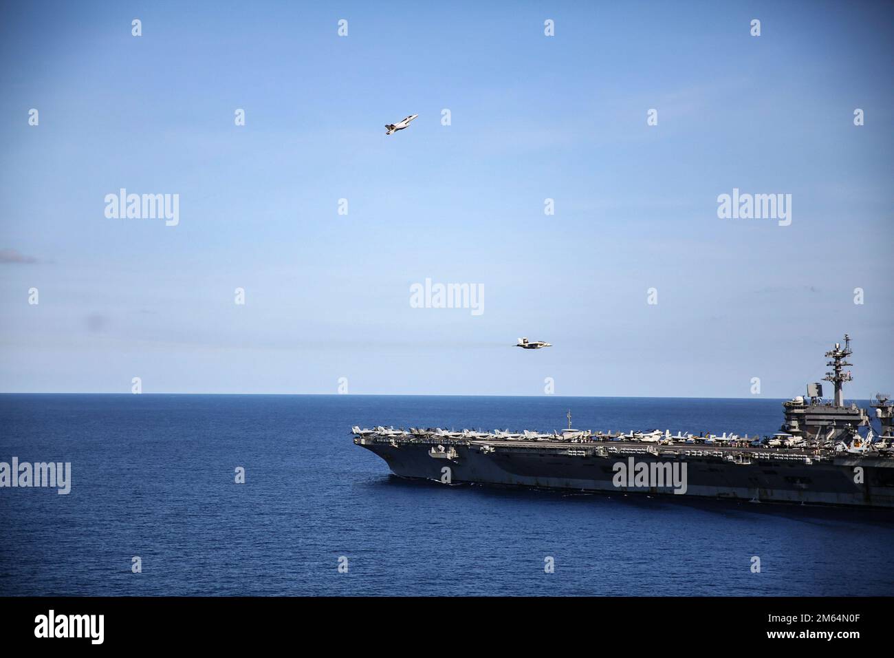SOUTH CHINA SEA (April 1, 2022) Capt. Michael Langbehn, left, outgoing ...