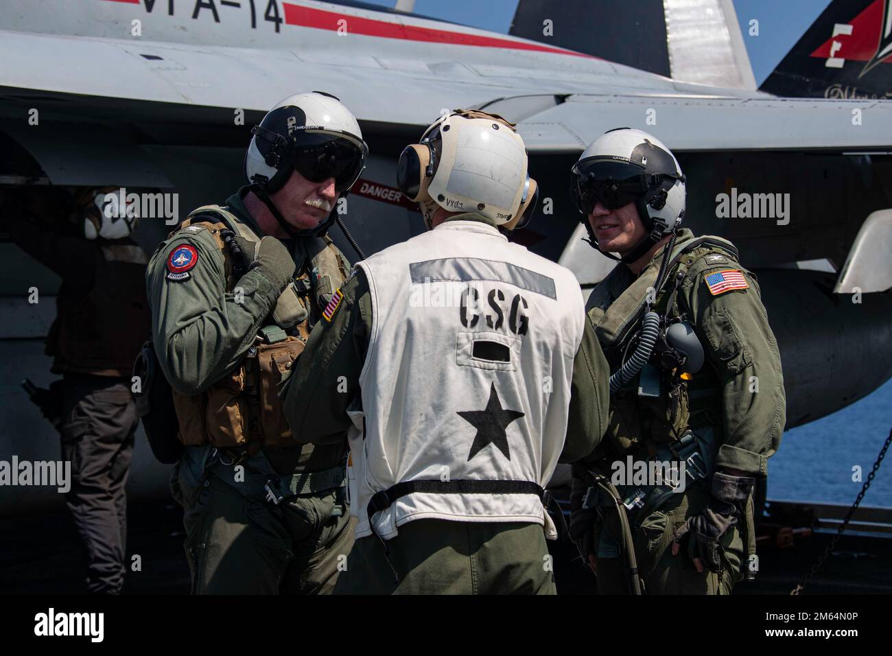 SOUTH CHINA SEA (April 1, 2022) Rear Admiral J.T. Anderson, middle, commander, Carrier Strike ...