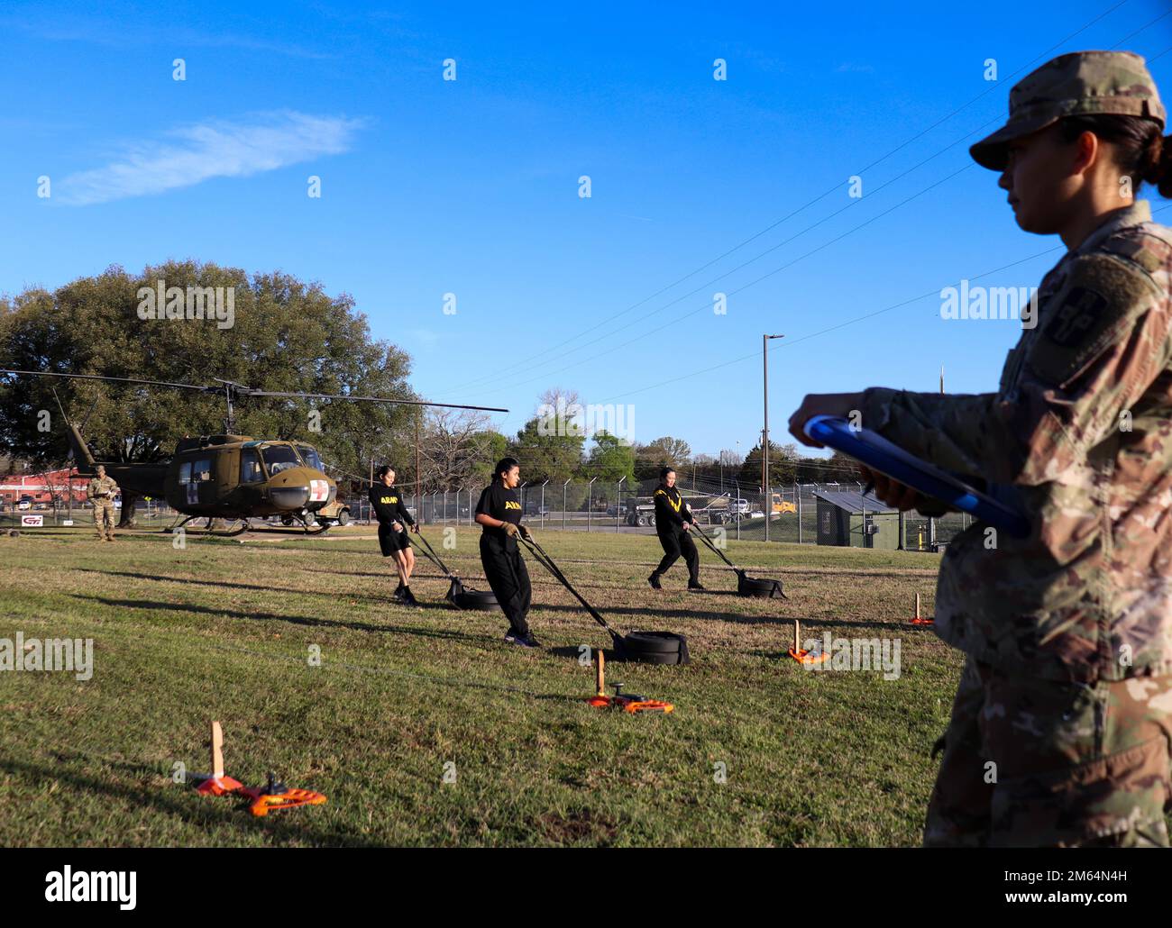 Soldiers with the 394th Field Hospital completes the sled drag portion ...