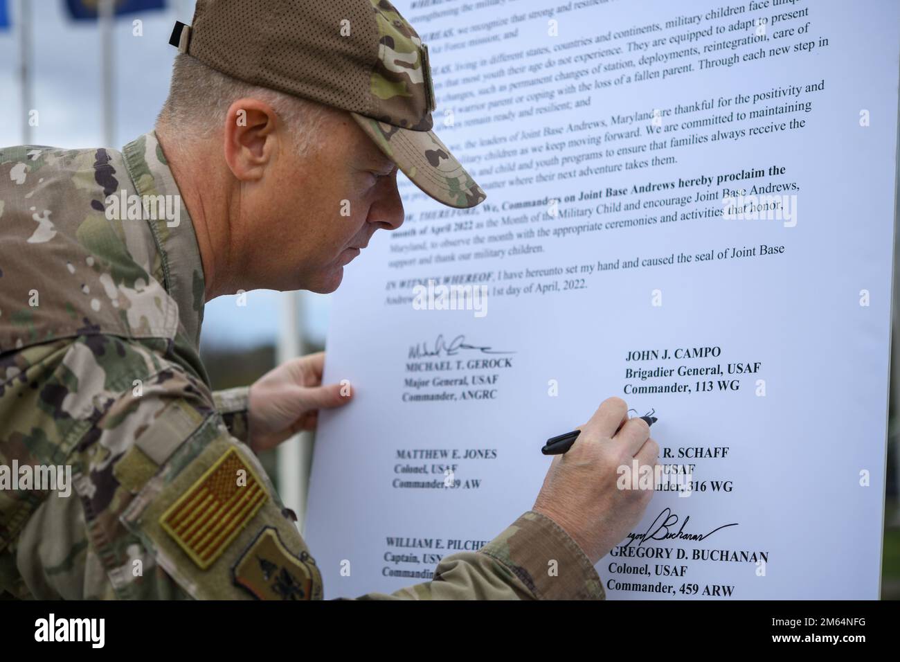 Col. Tyler Schaff, 316th Wing and installation commander, signs the ...
