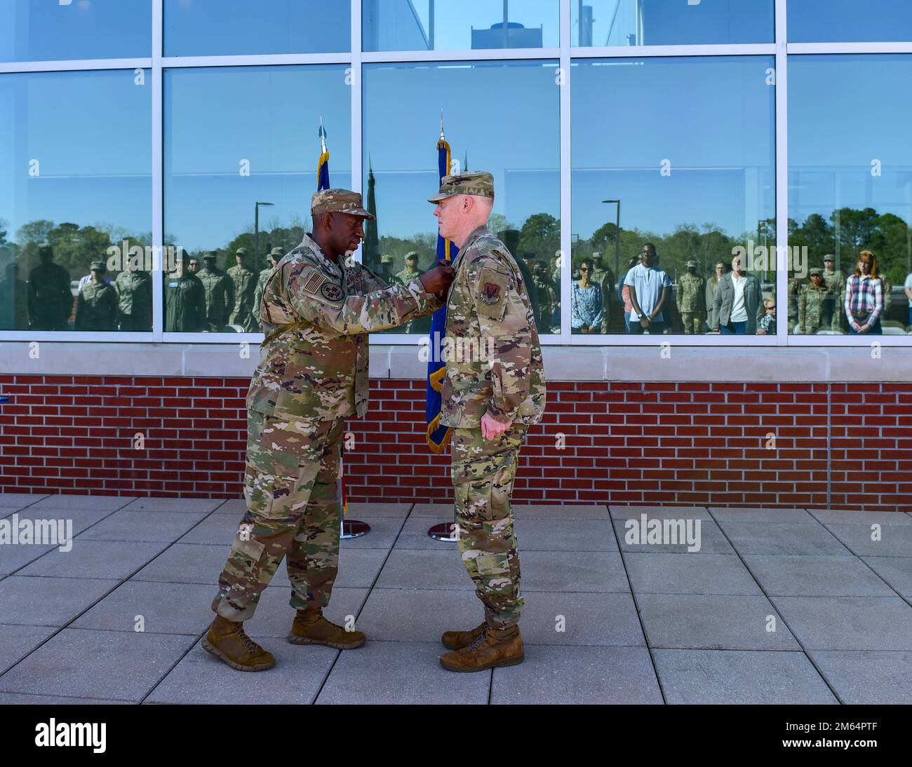 Col. Dolphis Hall, 4th Medical Group commander, left, pins the ...