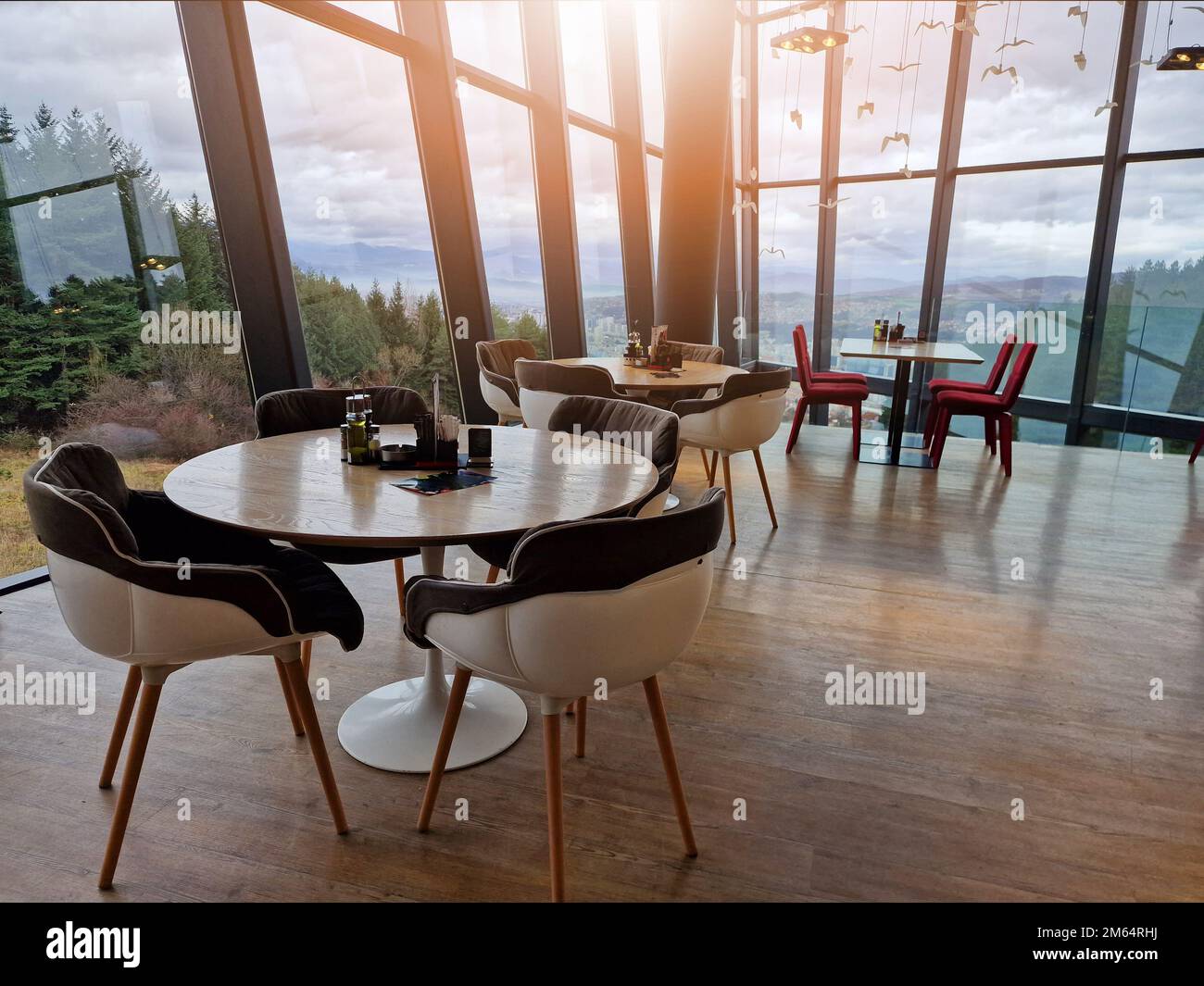 Tables and chairs set in modern cafe minimalistic interior design with ...