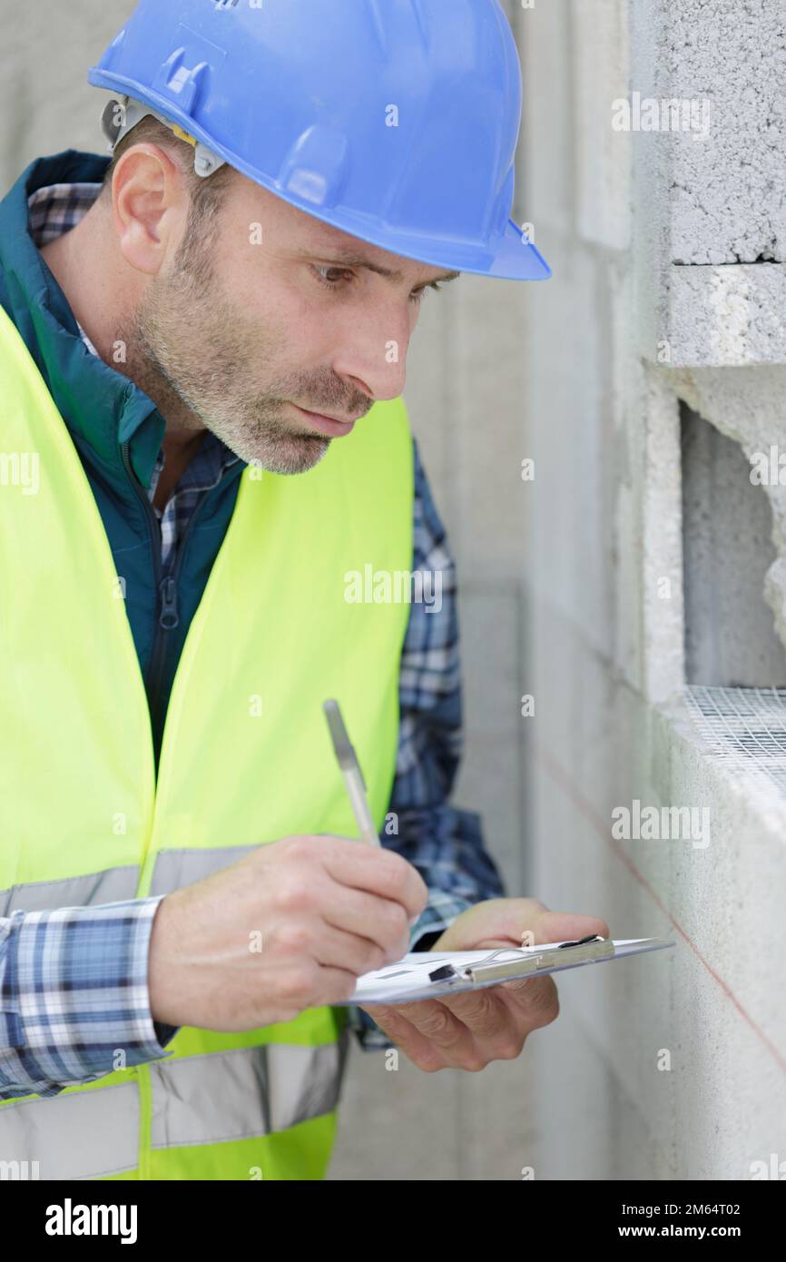 construction home inspector checking house Stock Photo - Alamy