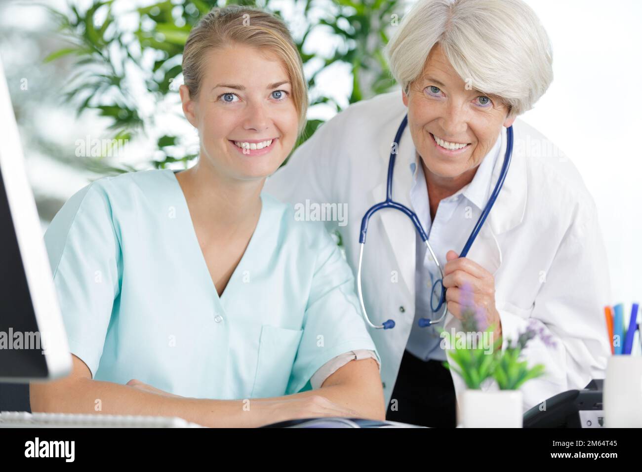 clinic staff made of doctors and nurses as team Stock Photo - Alamy