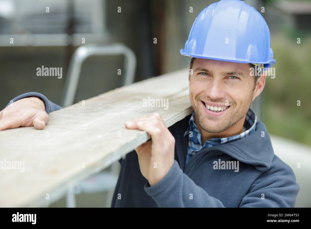 Workman carrying sign hi-res stock photography and images - Alamy