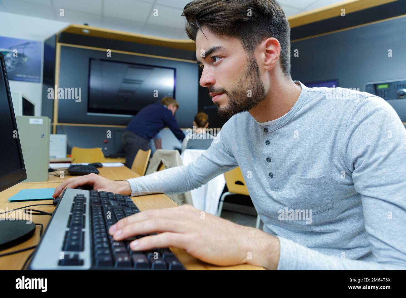 student using desktop computer in classroom Stock Photo - Alamy