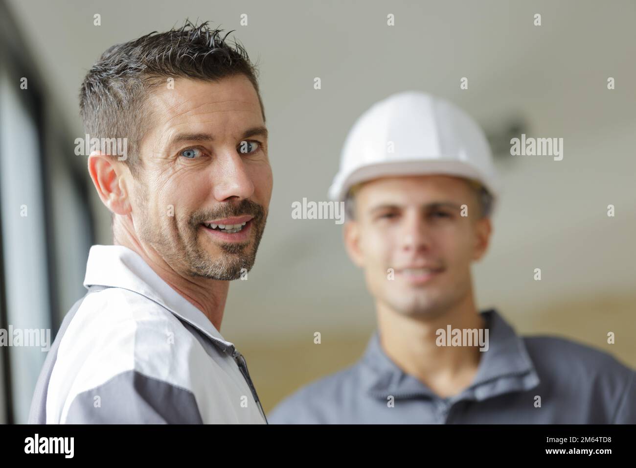 two engineers wearing hard hat Stock Photo - Alamy