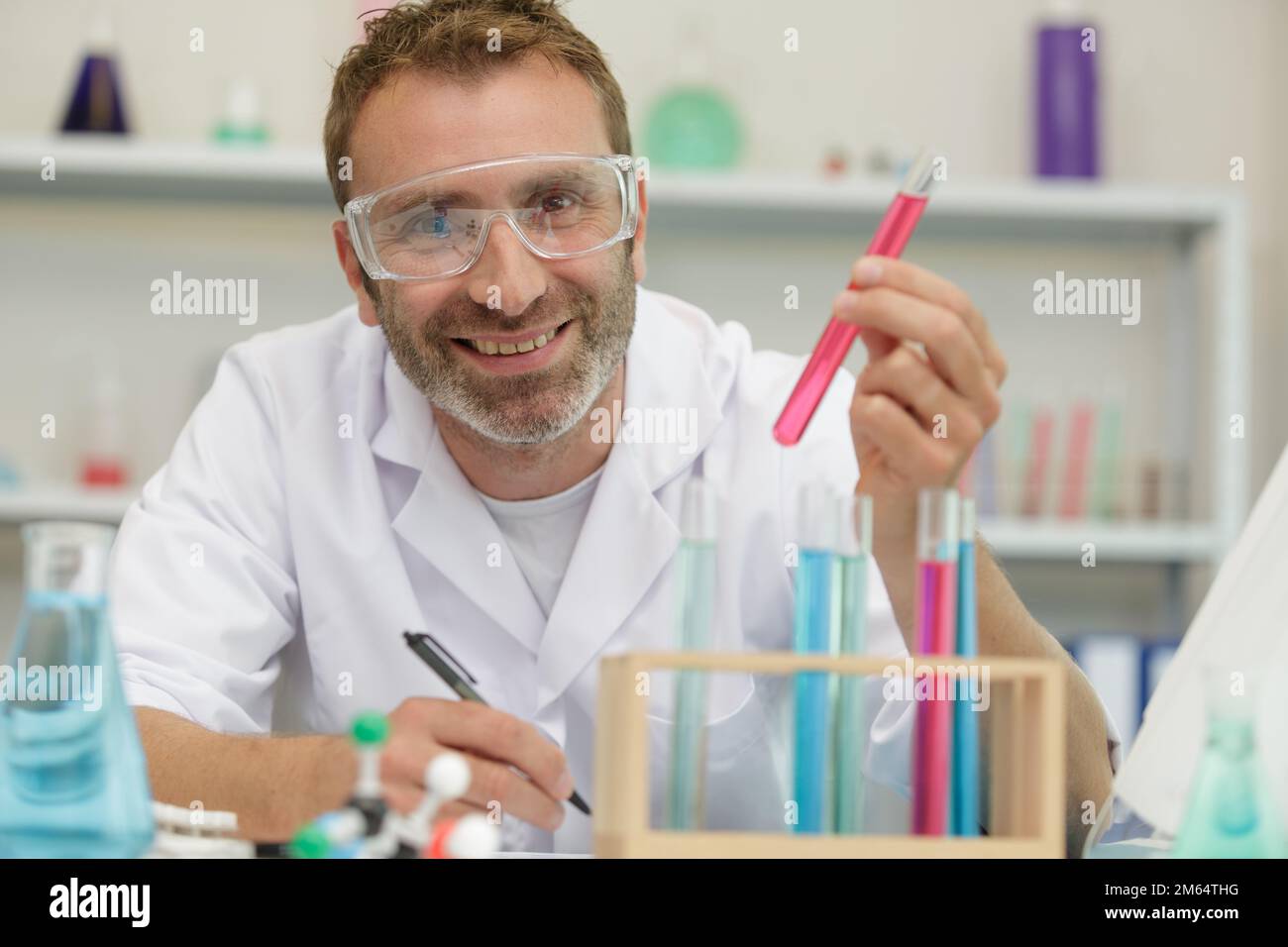 happy handsome smiling mature man in white laboratory coat Stock Photo ...