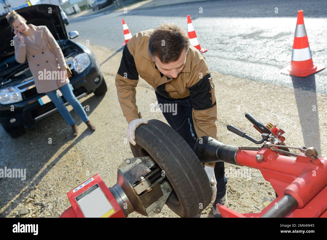 woman punctured her car and phone for help Stock Photo - Alamy