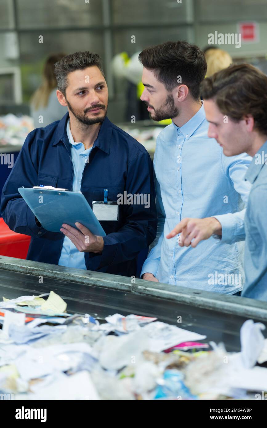 workers in waste processing plan Stock Photo - Alamy