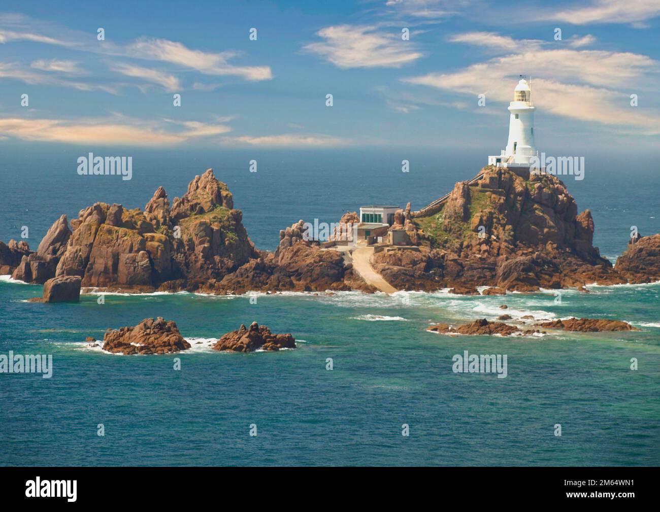 A scenic view of La Corbiere Lighthouse in summer Stock Photo - Alamy