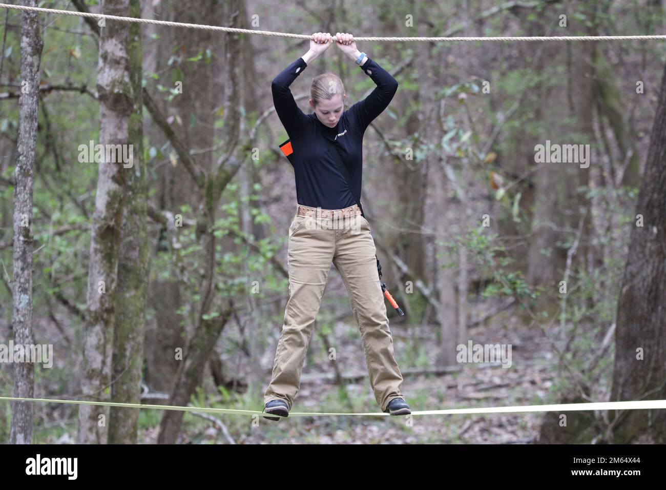 A U.S. Marine Corps officer candidate, Carolina Owens, maneuvers across ...